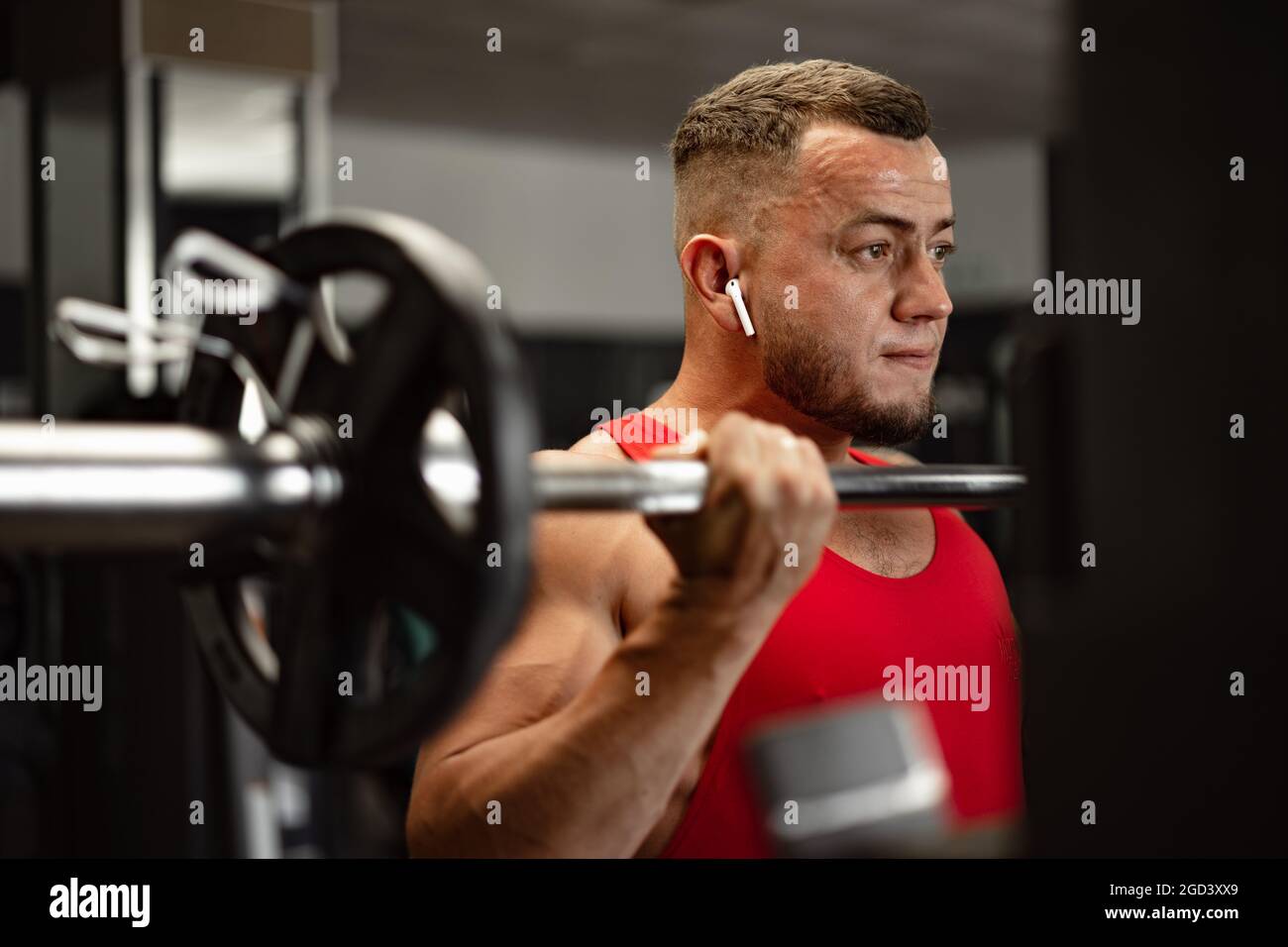 Strong man athlete exercise in gym, close up portrait Stock Photo - Alamy
