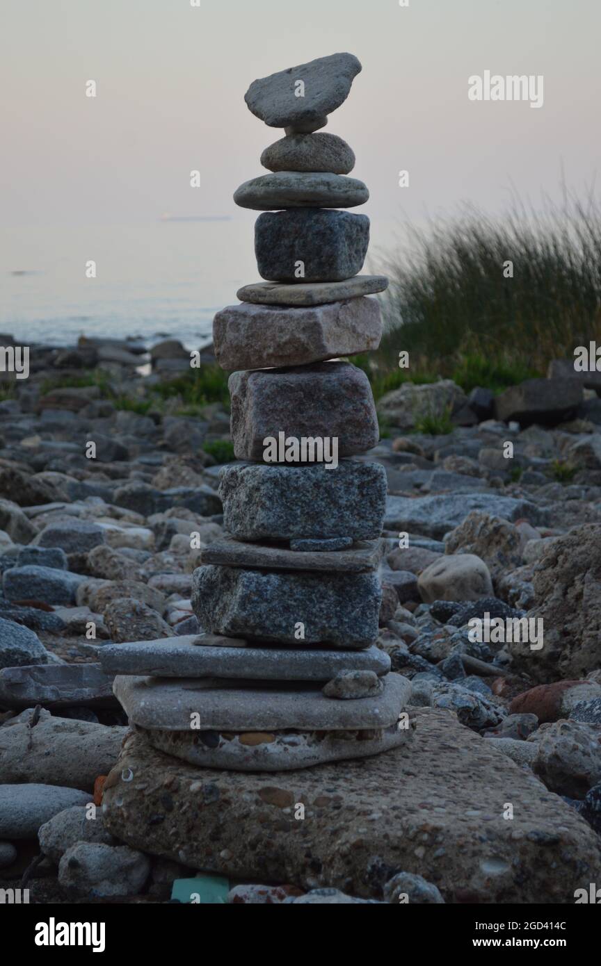 Sculpture made by stones at the beach as a landmark Stock Photo - Alamy