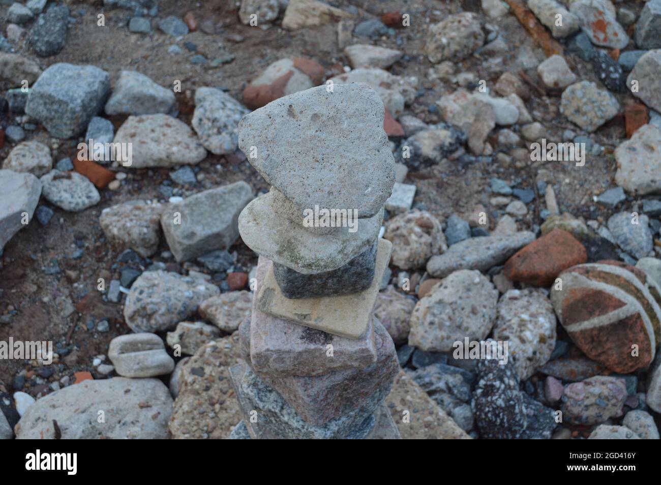 Sculpture made by stones at the beach as a landmark Stock Photo - Alamy