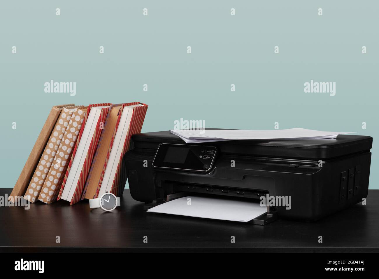 Compact home laser printer against gray background Stock Photo - Alamy