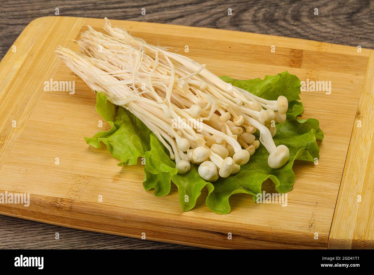 Raw Japanese Enoki mushrooms for cooking Stock Photo - Alamy
