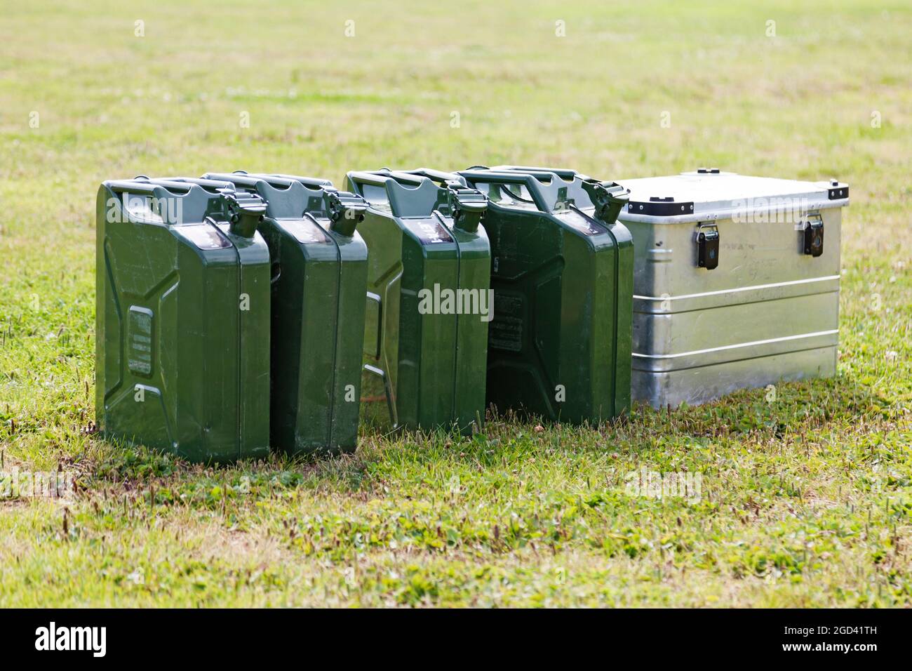 green petrol tanks lined up to refuel a helicopter Stock Photo - Alamy