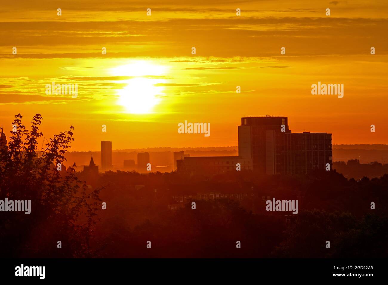 Beautiful, bright orange sunrise over London as viewed from Parliament ...