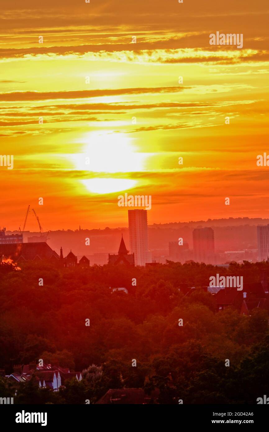 Beautiful, bright orange sunrise over London as viewed from Parliament ...