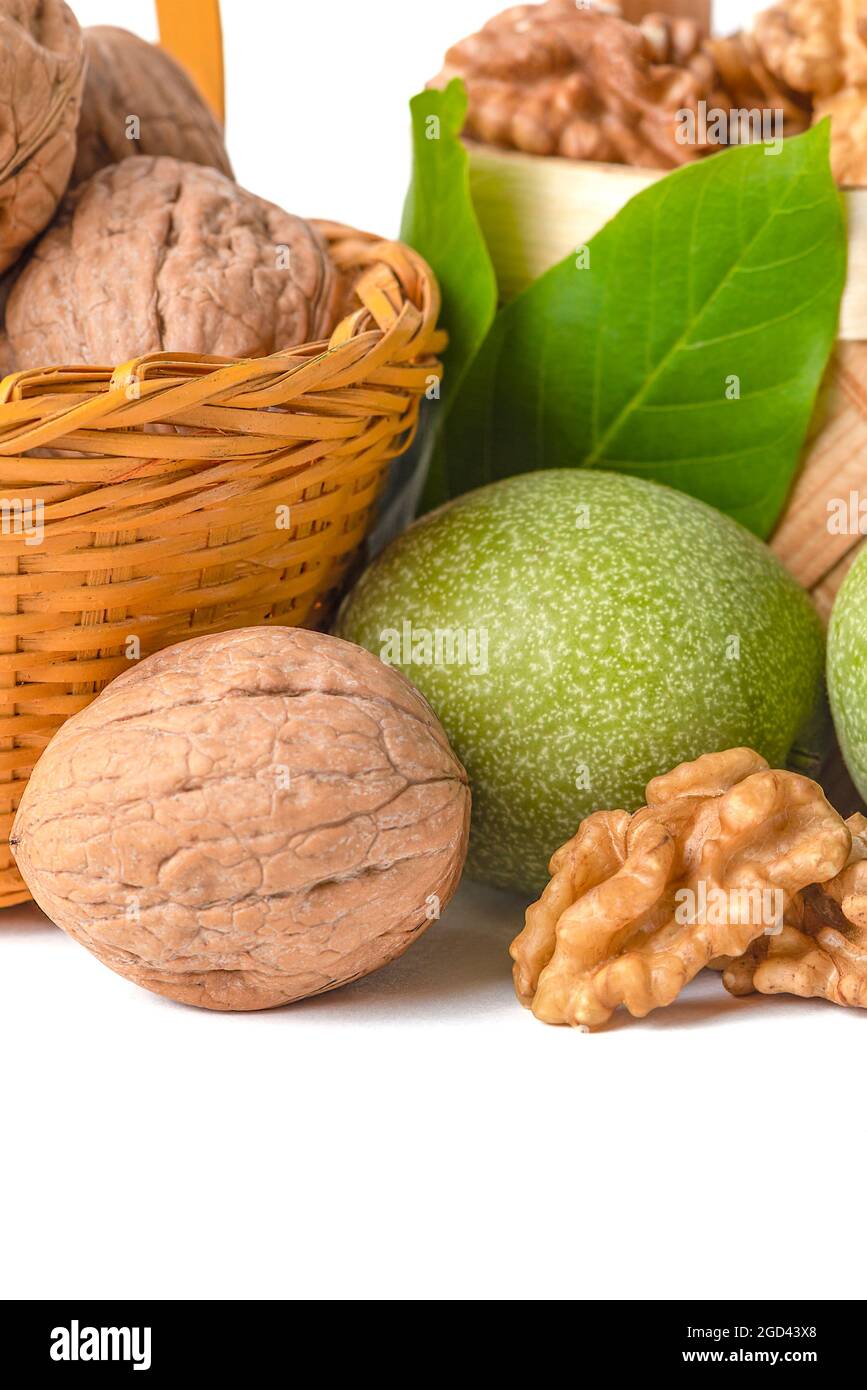 Walnut. Walnut fruits of different varieties lie in wooden saucers and ...