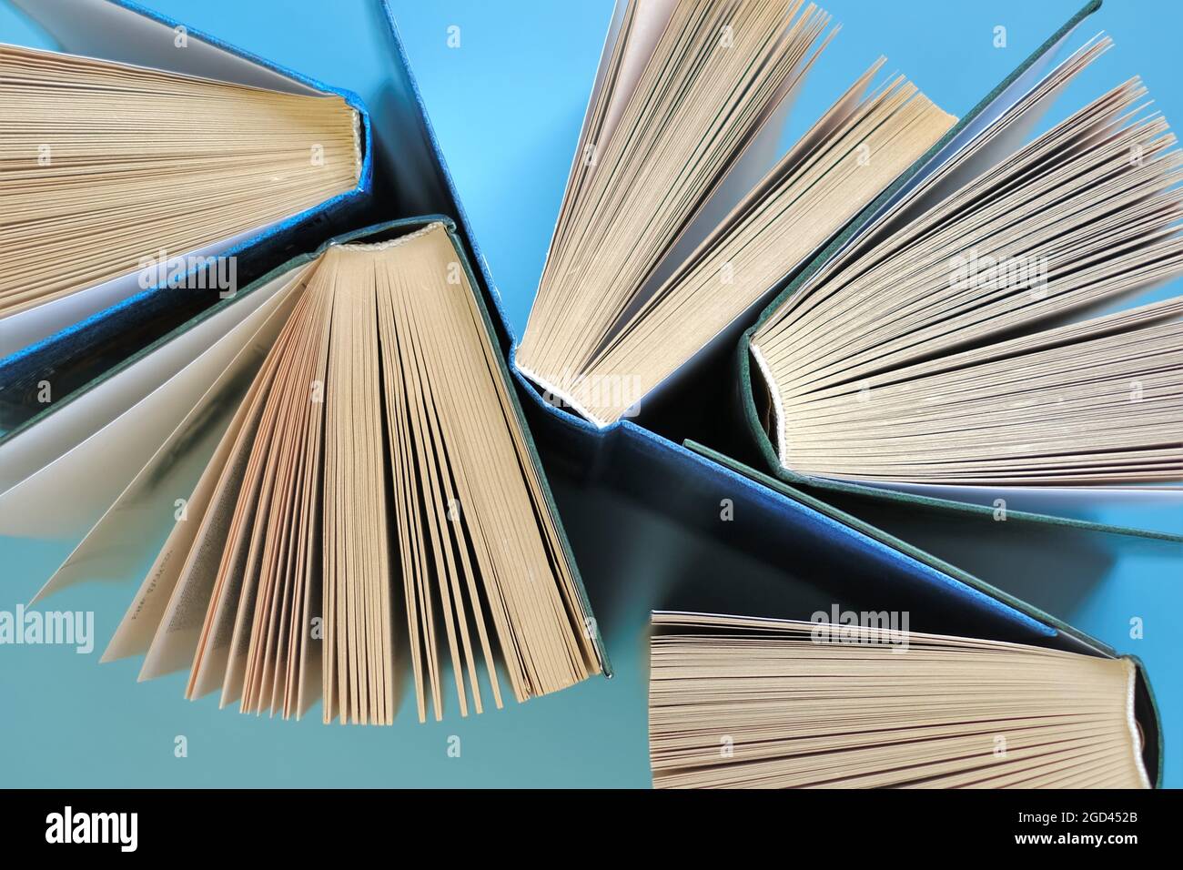 Books on a blue background.Reading of books.Knowledge and Learning ...