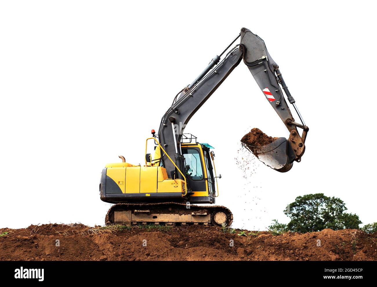 Yellow digger on hill lifting dirt against a white background Stock ...