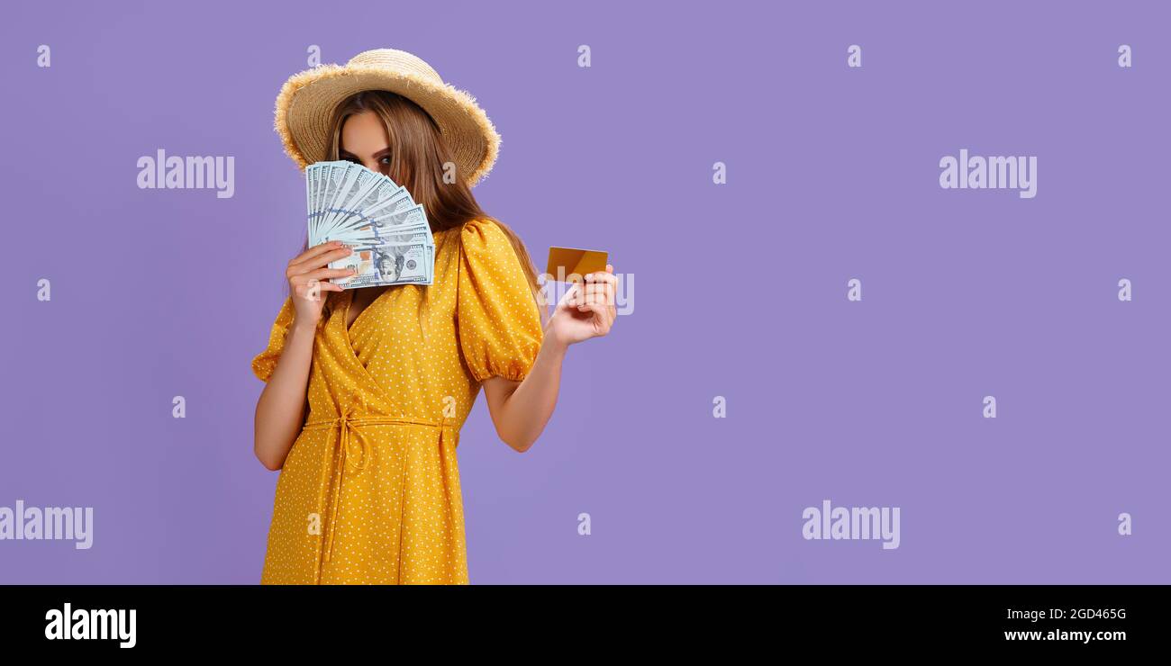 Caucasian woman 20s wearing straw hat holding credit card and fan of ...