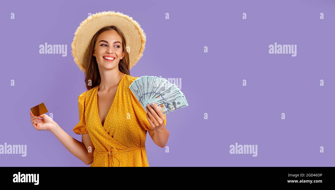 Caucasian woman 20s wearing straw hat holding credit card and fan of ...
