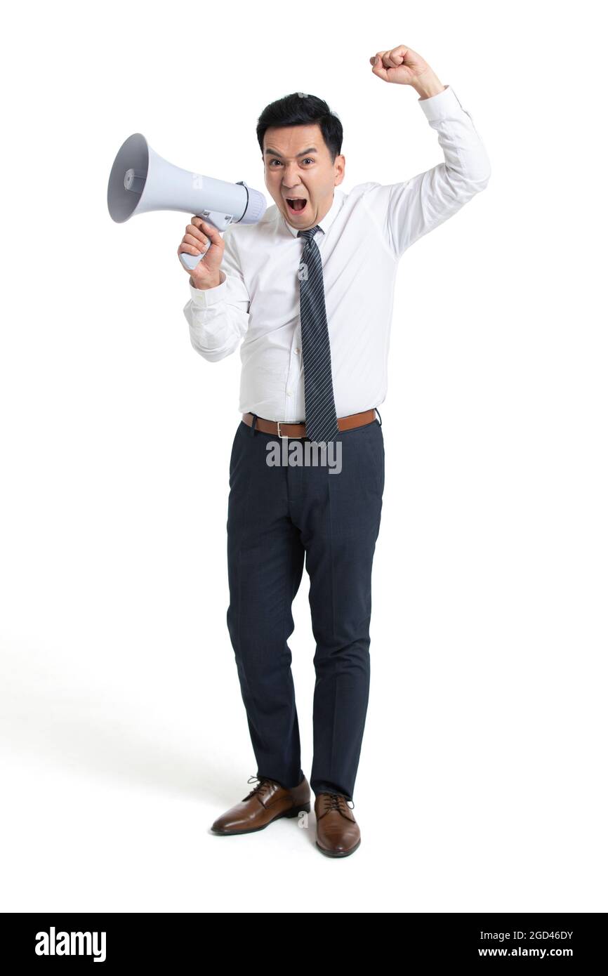 Mature businessman shouting through bullhorn Stock Photo - Alamy