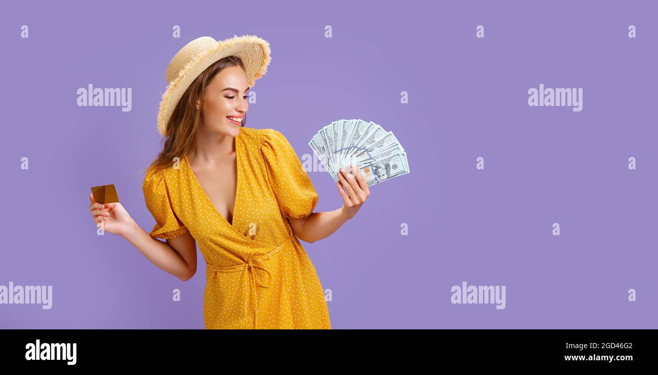 Caucasian woman 20s wearing straw hat holding credit card and fan of ...