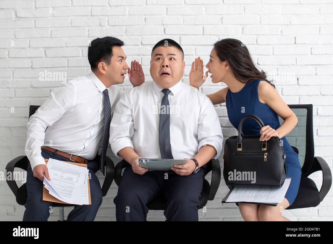 Business people talking gossip Stock Photo - Alamy