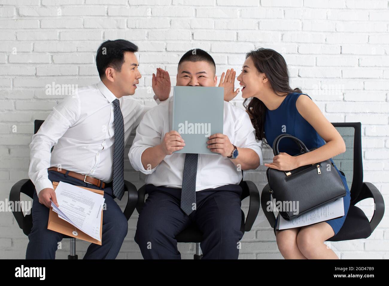 Business people talking gossip Stock Photo - Alamy