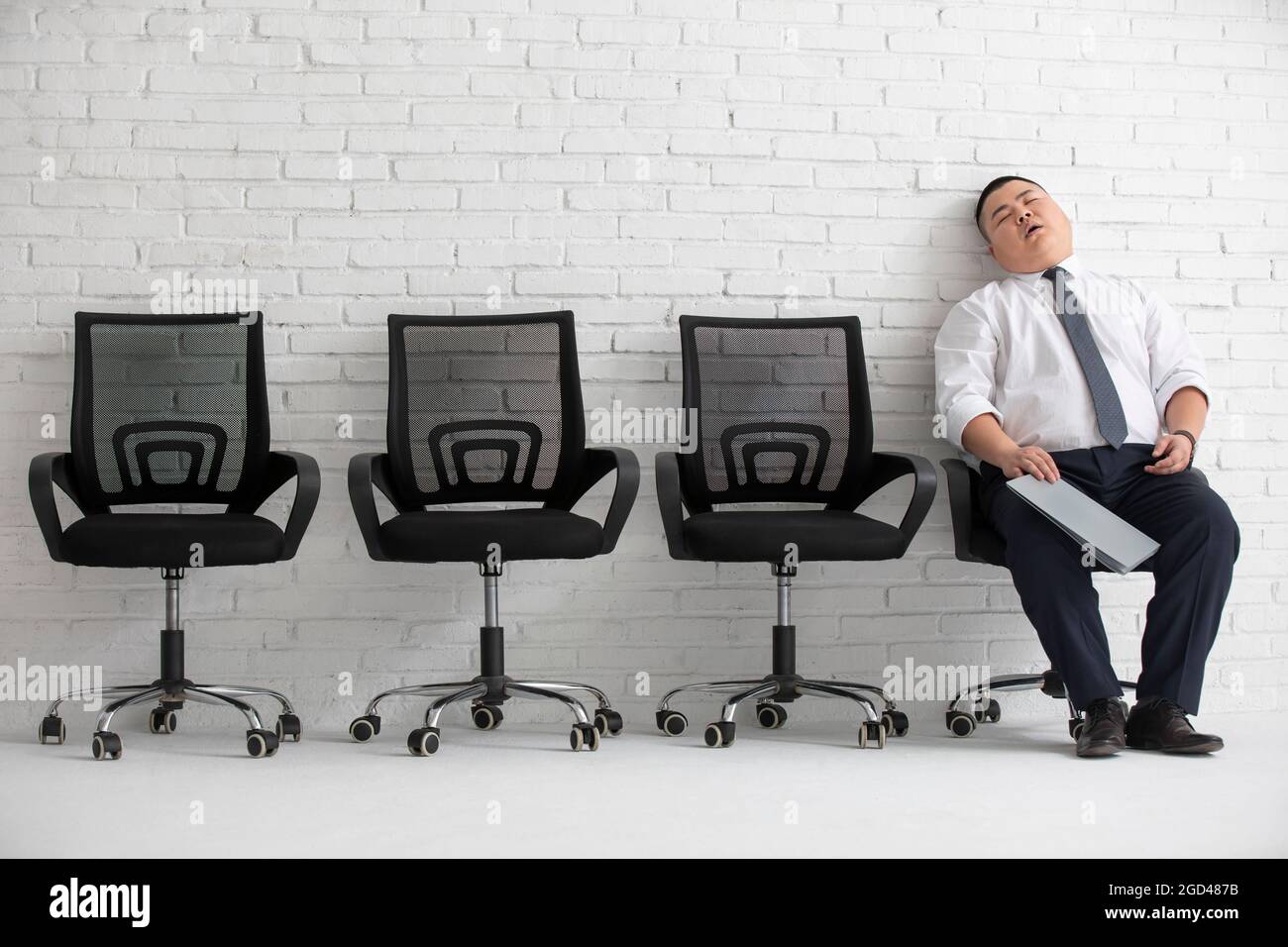 Young businessman waiting for job interview Stock Photo - Alamy