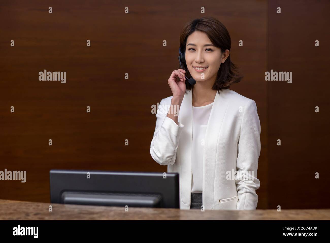 Chinese woman hotel receptionist hi-res stock photography and images ...