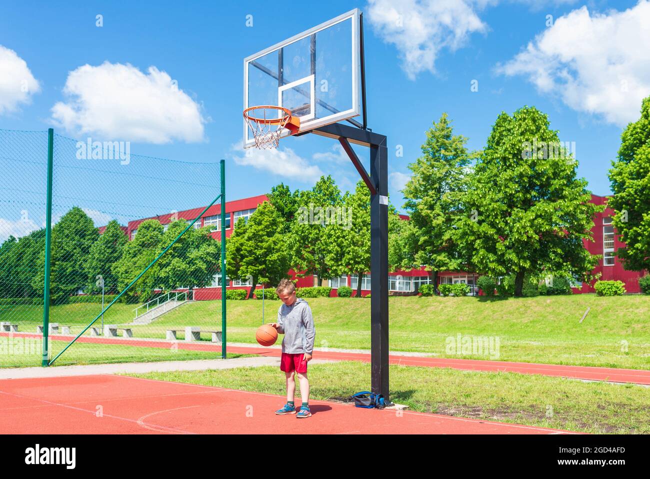 Young 10s boy having fun playing basketball outdoors.nice,cool ...
