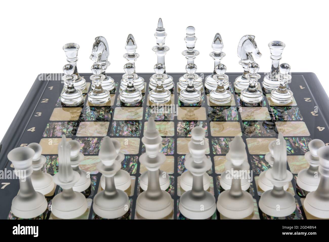 Transparent different glass chess pieces figures standing on pearl ...