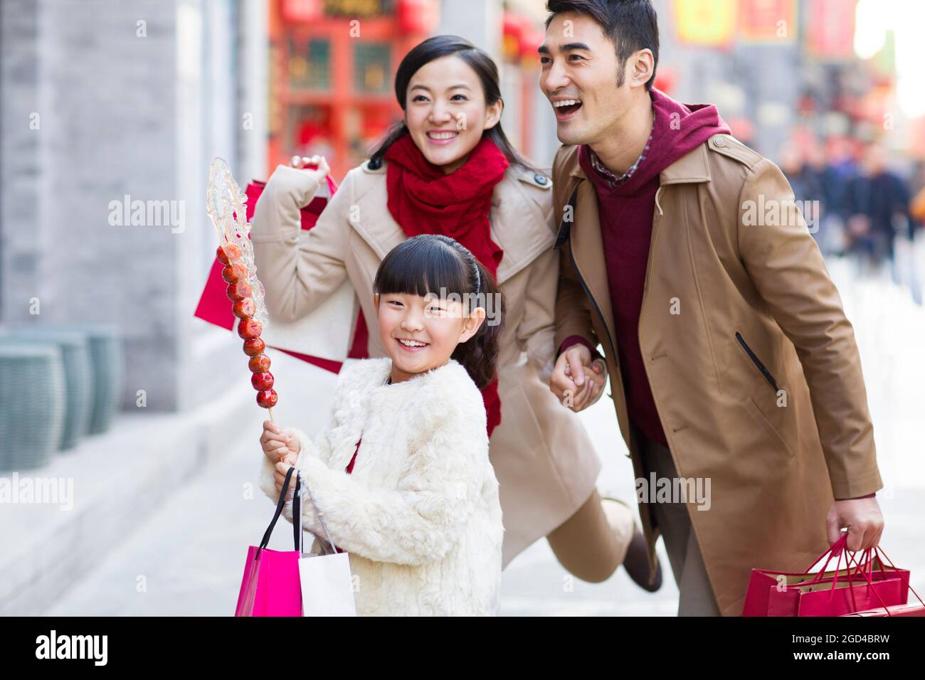Happy family shopping for Chinese New Year Stock Photo - Alamy