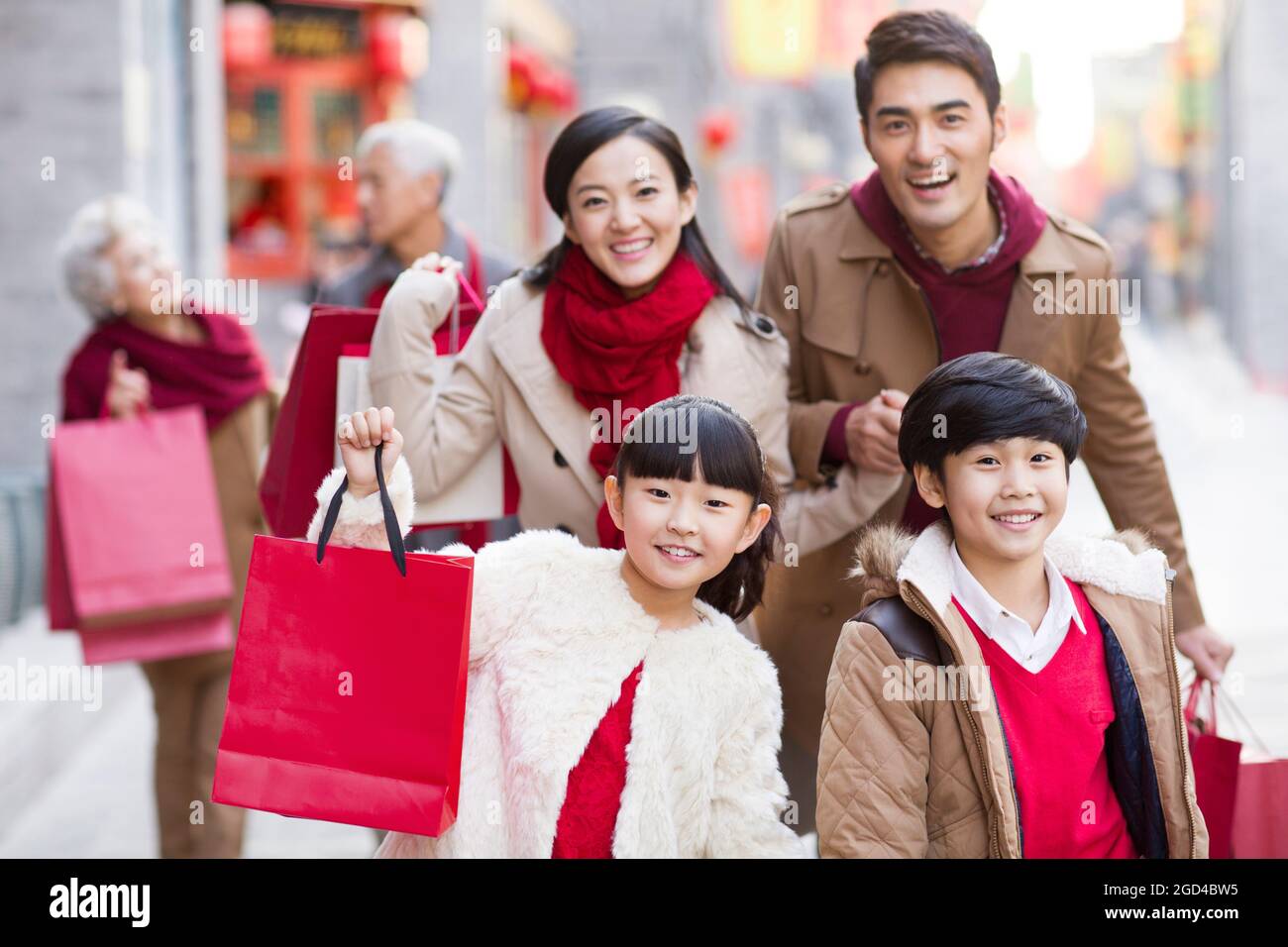 Happy family shopping for Chinese New Year Stock Photo - Alamy