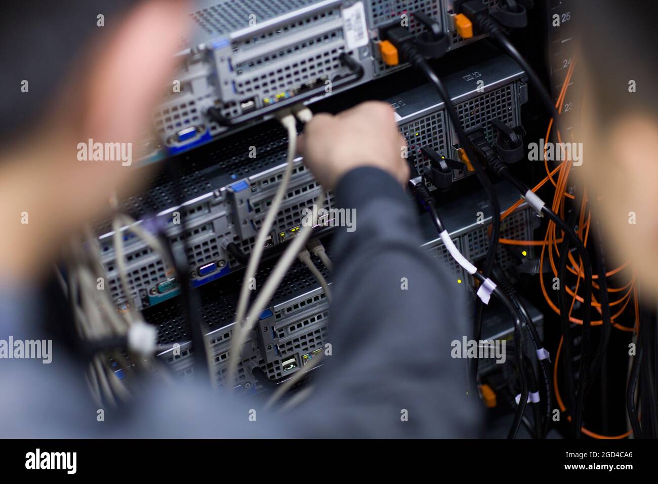 Technicians doing maintenance in computer room Stock Photo - Alamy
