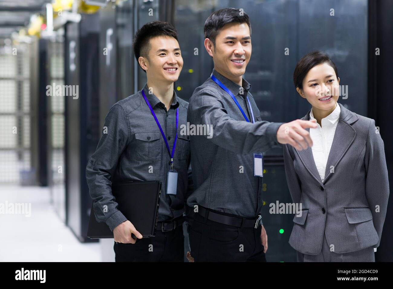 Business team visiting computer room Stock Photo - Alamy