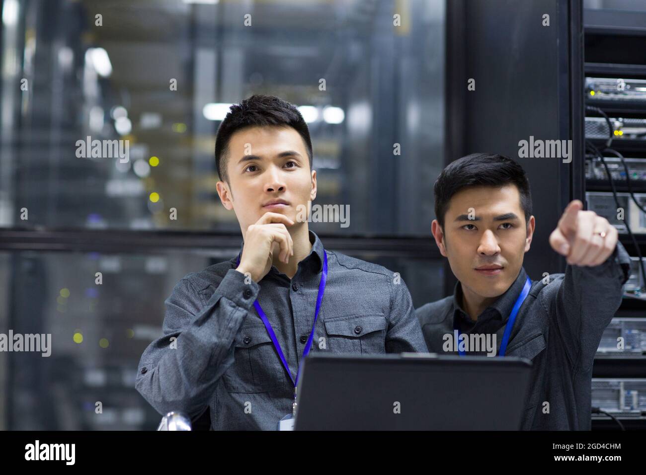 Technicians doing maintenance in computer room Stock Photo - Alamy