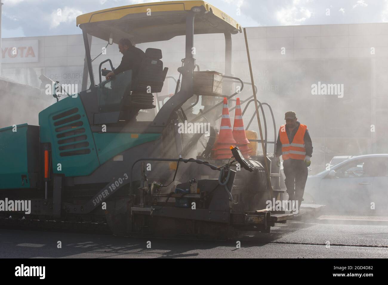 Tula, Russia - May 16, 2021: Process of asphalting, asphalt paver ...