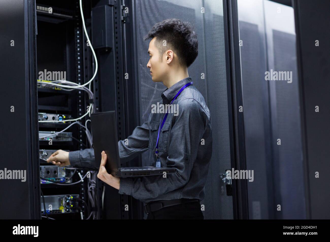Technician looking laptop doing hi-res stock photography and images - Alamy