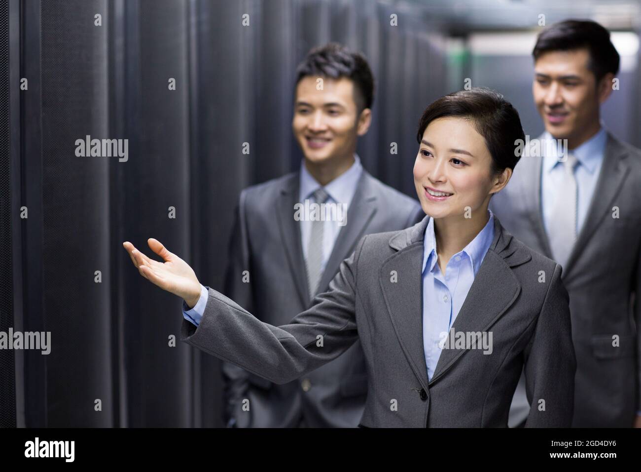 Business team visiting computer room Stock Photo - Alamy