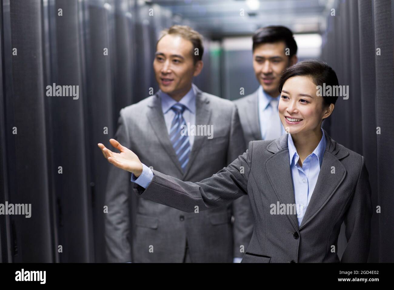 Business team visiting computer room Stock Photo - Alamy