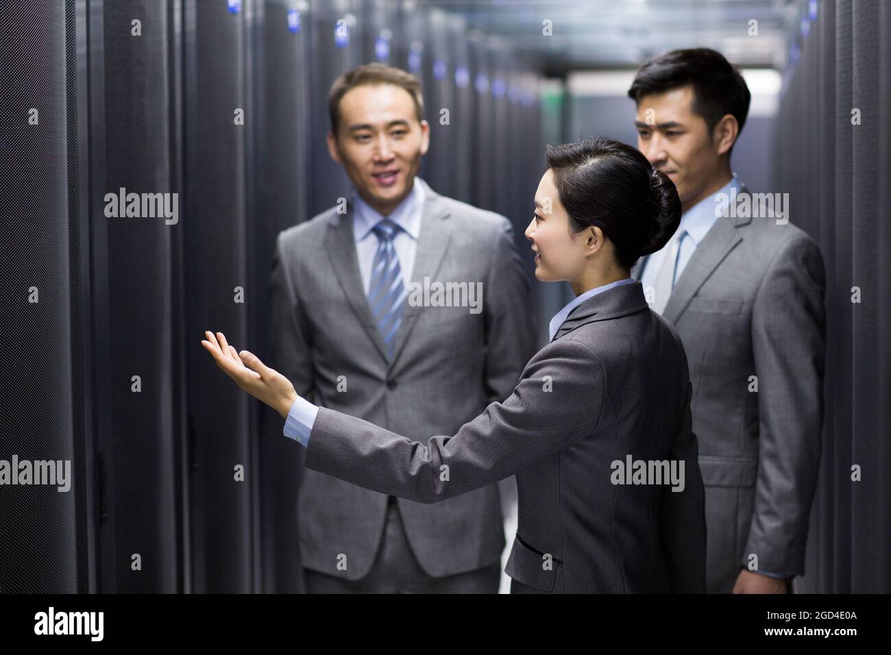 Business team visiting computer room Stock Photo - Alamy