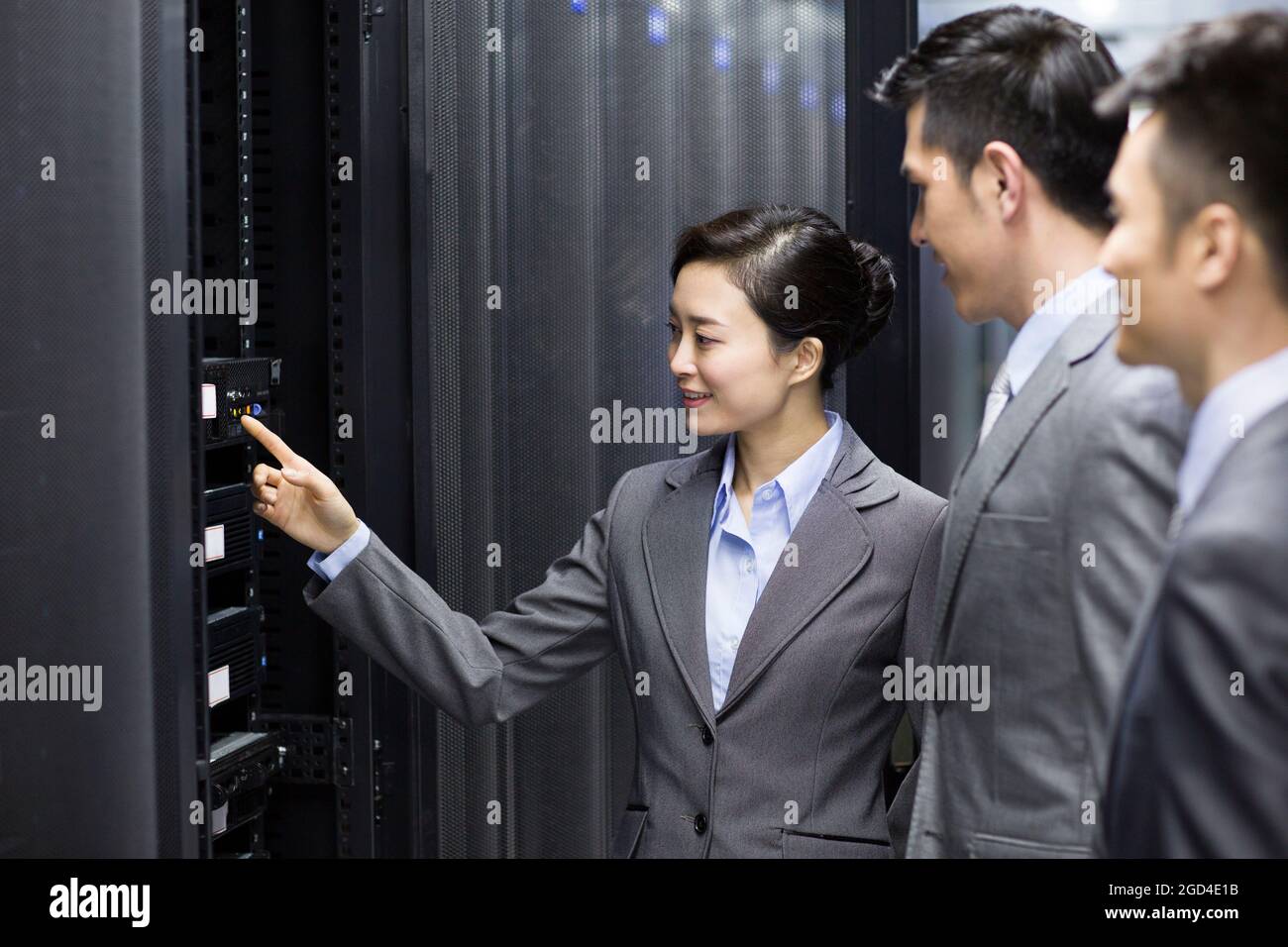 Business team visiting computer room Stock Photo - Alamy