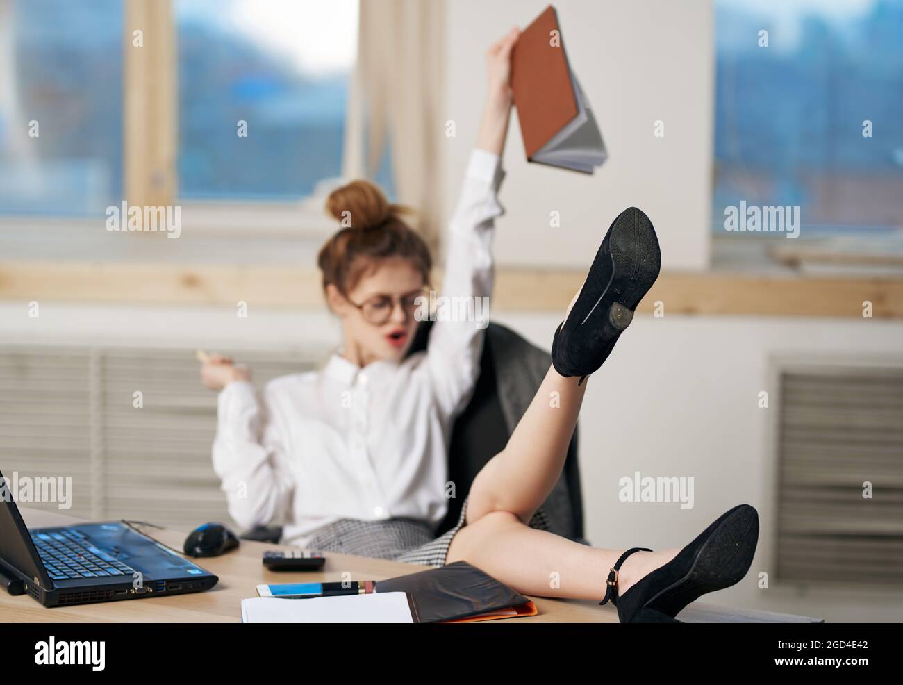 emotional woman secretary work desk manager office Stock Photo - Alamy