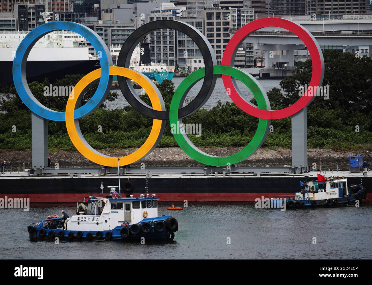 Boats prepare to tow giant Olympic rings as they are removed from the ...