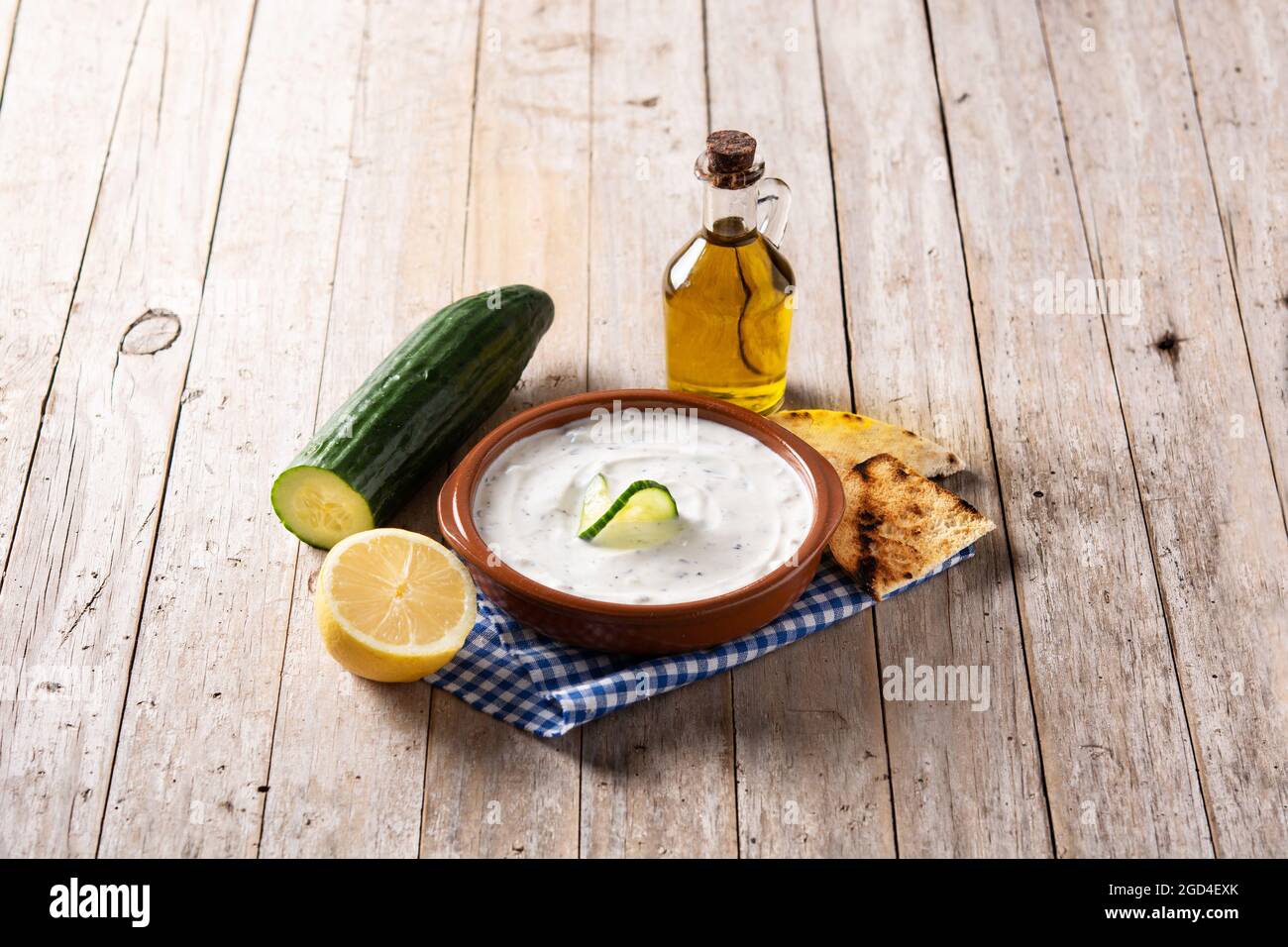 Traditional Greek Tzatziki on wooden table Stock Photo - Alamy