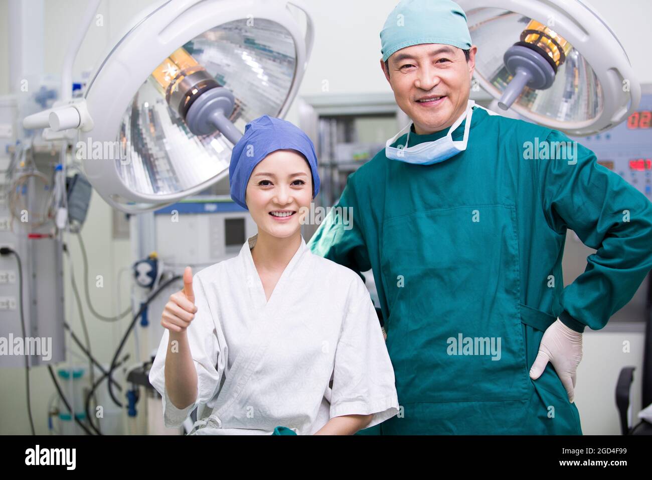Patient with doctor after a successful plastic surgery Stock Photo - Alamy