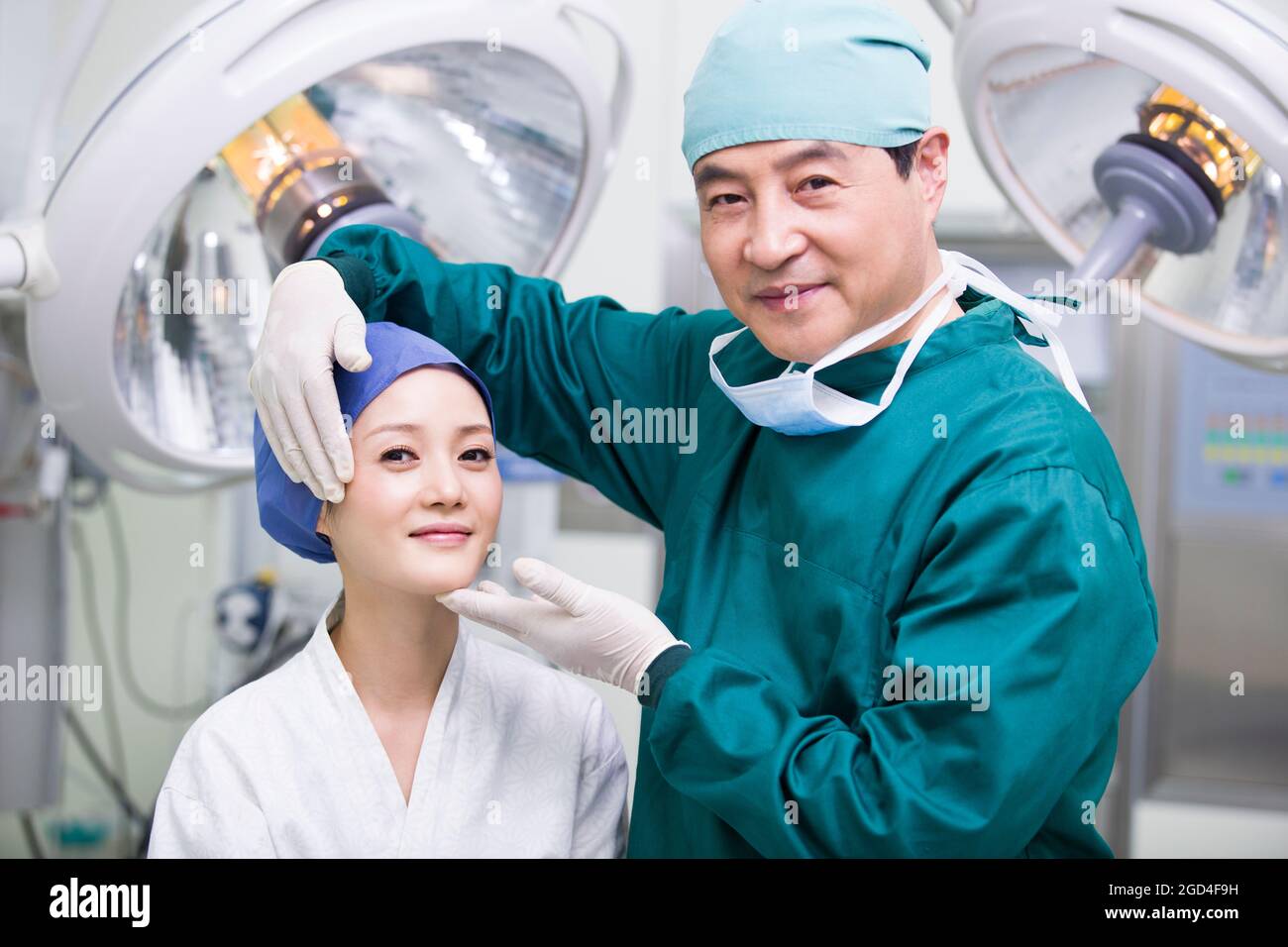 Patient and doctor smiling after a successful plastic surgery Stock ...