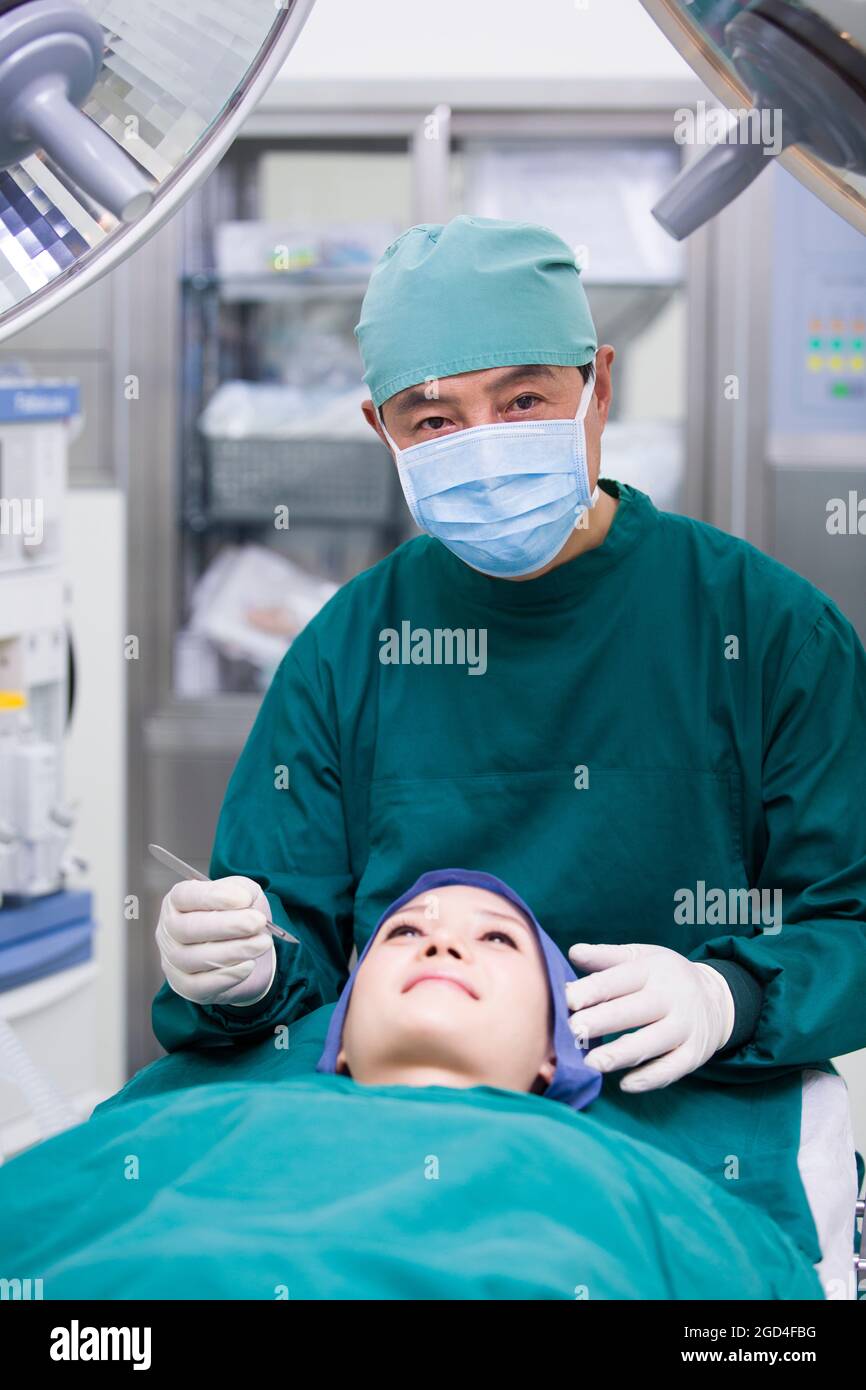 Patient on operating table receiving plastic surgery Stock Photo - Alamy
