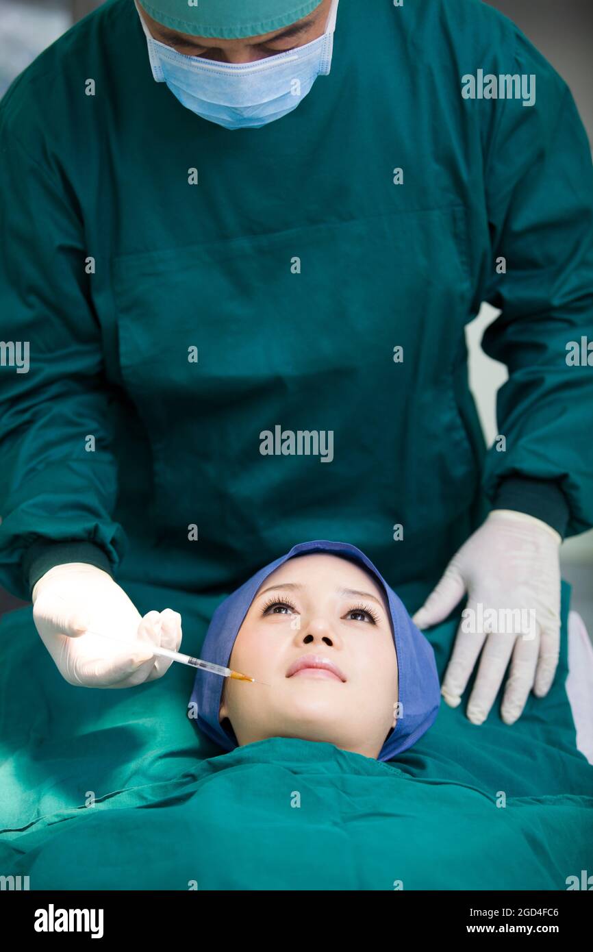 Patient on operating table receiving plastic surgery Stock Photo - Alamy