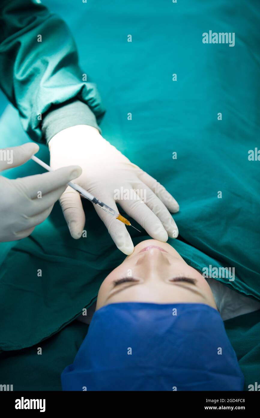 Patient on operating table receiving plastic surgery Stock Photo - Alamy