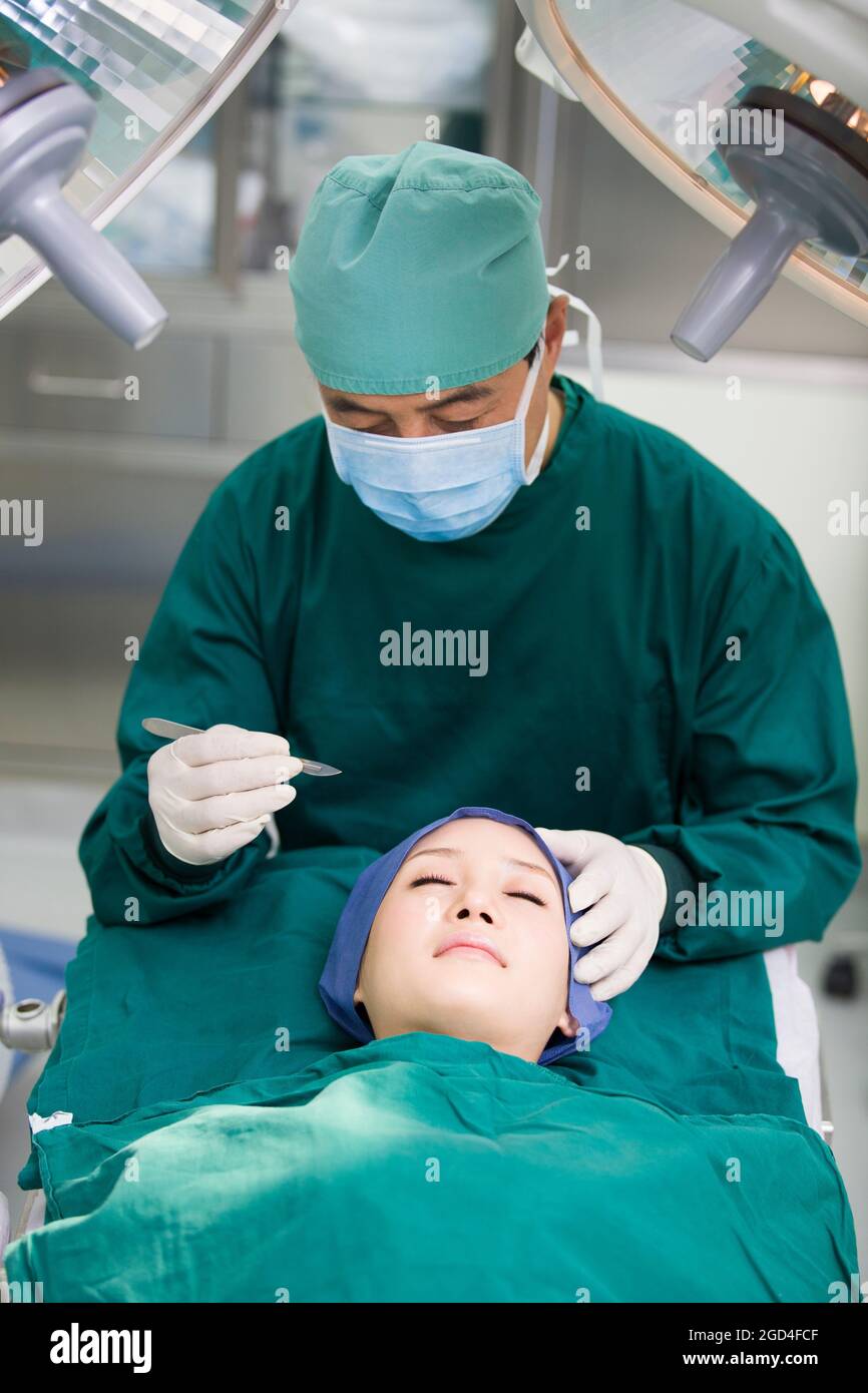 Patient on operating table receiving plastic surgery Stock Photo - Alamy