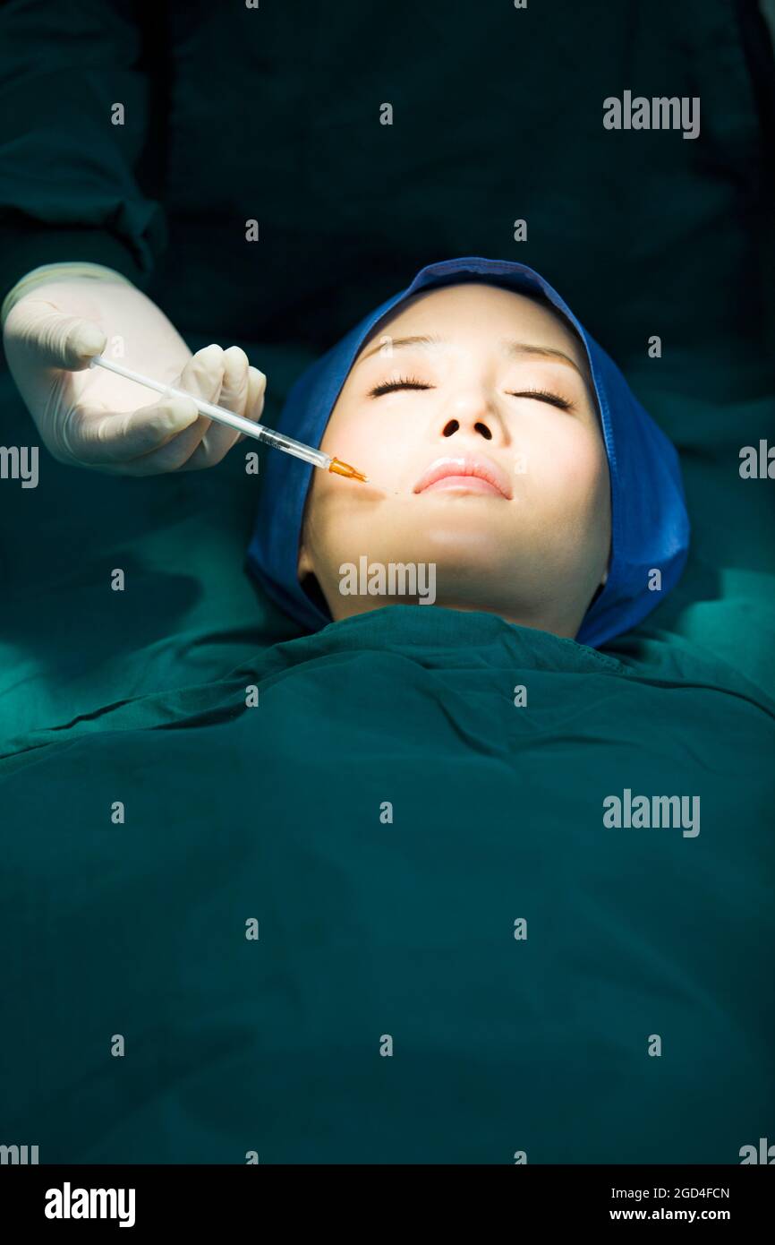 Patient on operating table receiving plastic surgery Stock Photo - Alamy