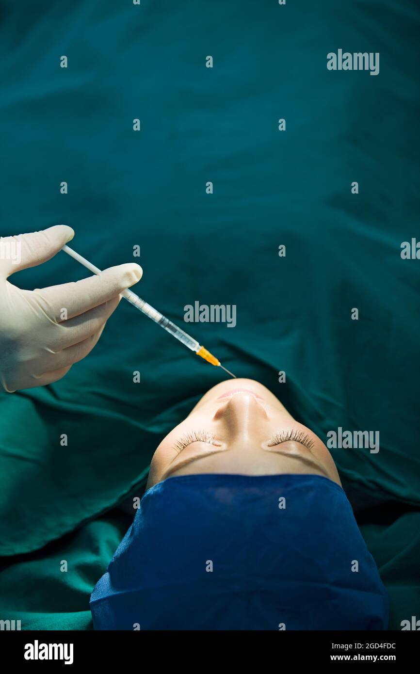 Patient on operating table receiving plastic surgery Stock Photo - Alamy