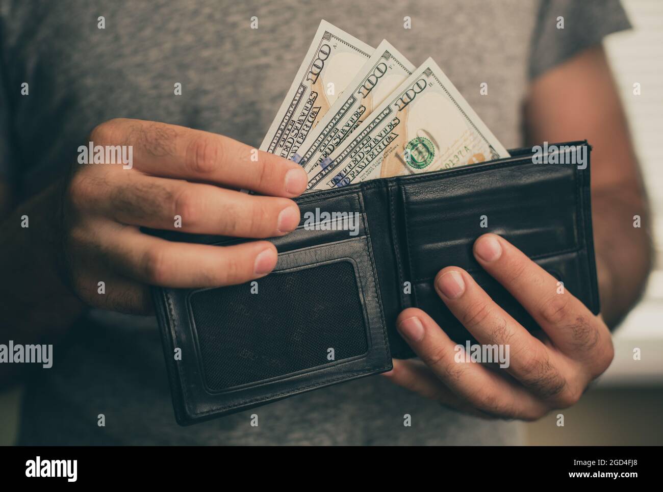 Man looks in the wallet. Cash. Wealthy man counting his money. Close up ...