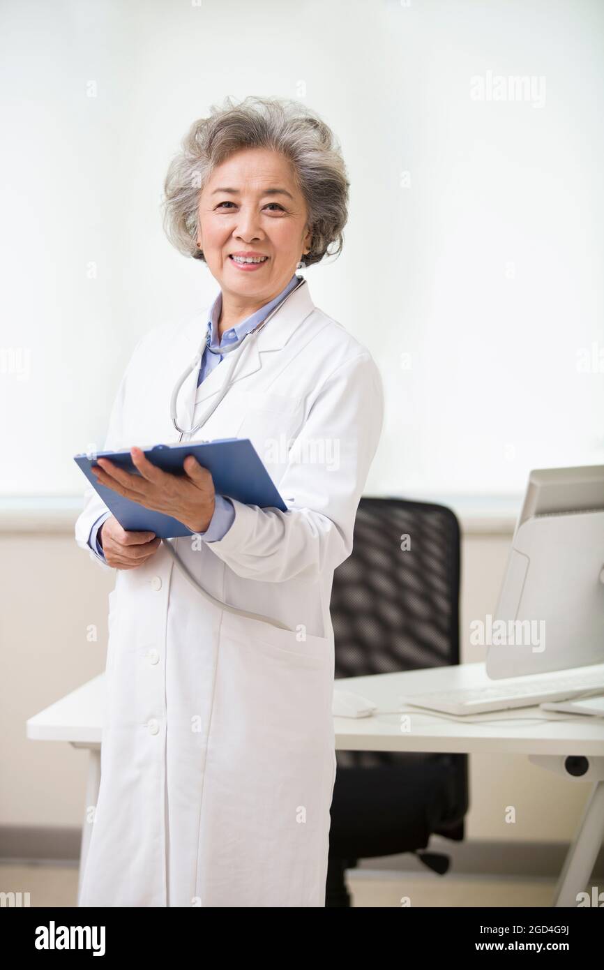 Portrait female doctor checking hi-res stock photography and images - Alamy