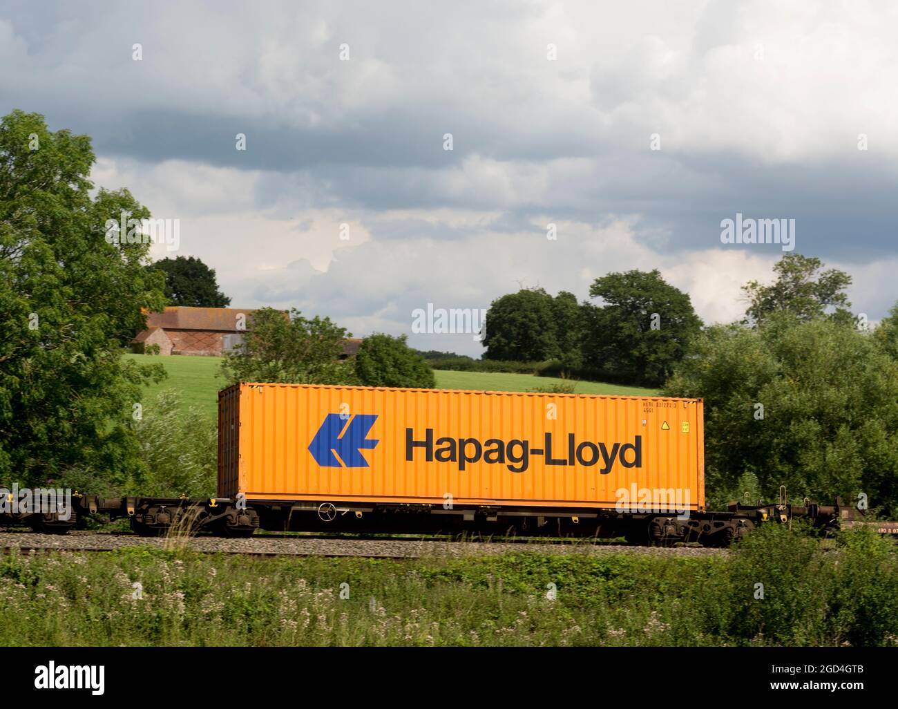A Hapag-Lloyd shipping container on a freightliner train, Warwickshire ...