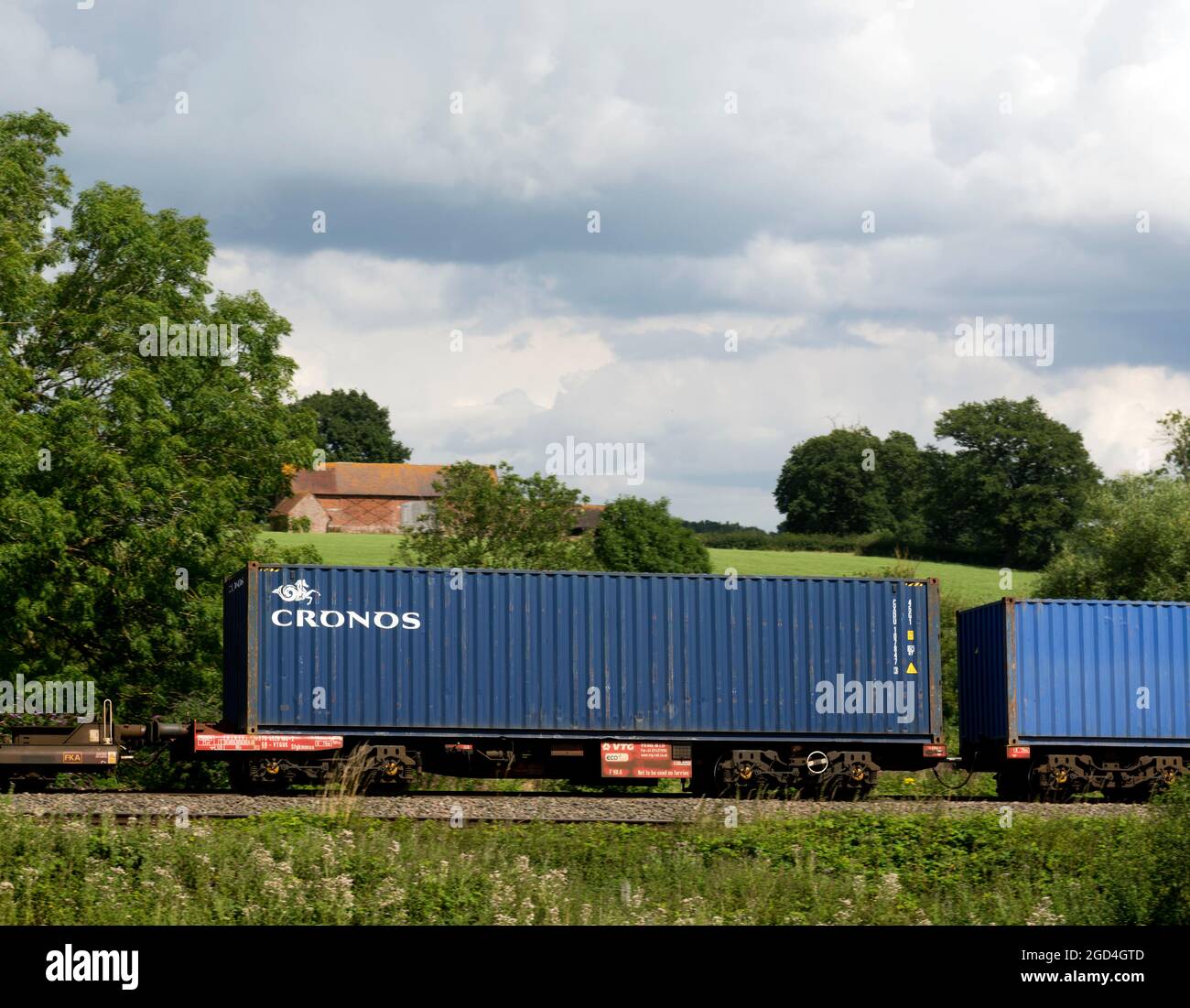 A Cronos shipping container on a freightliner train, Warwickshire, UK ...