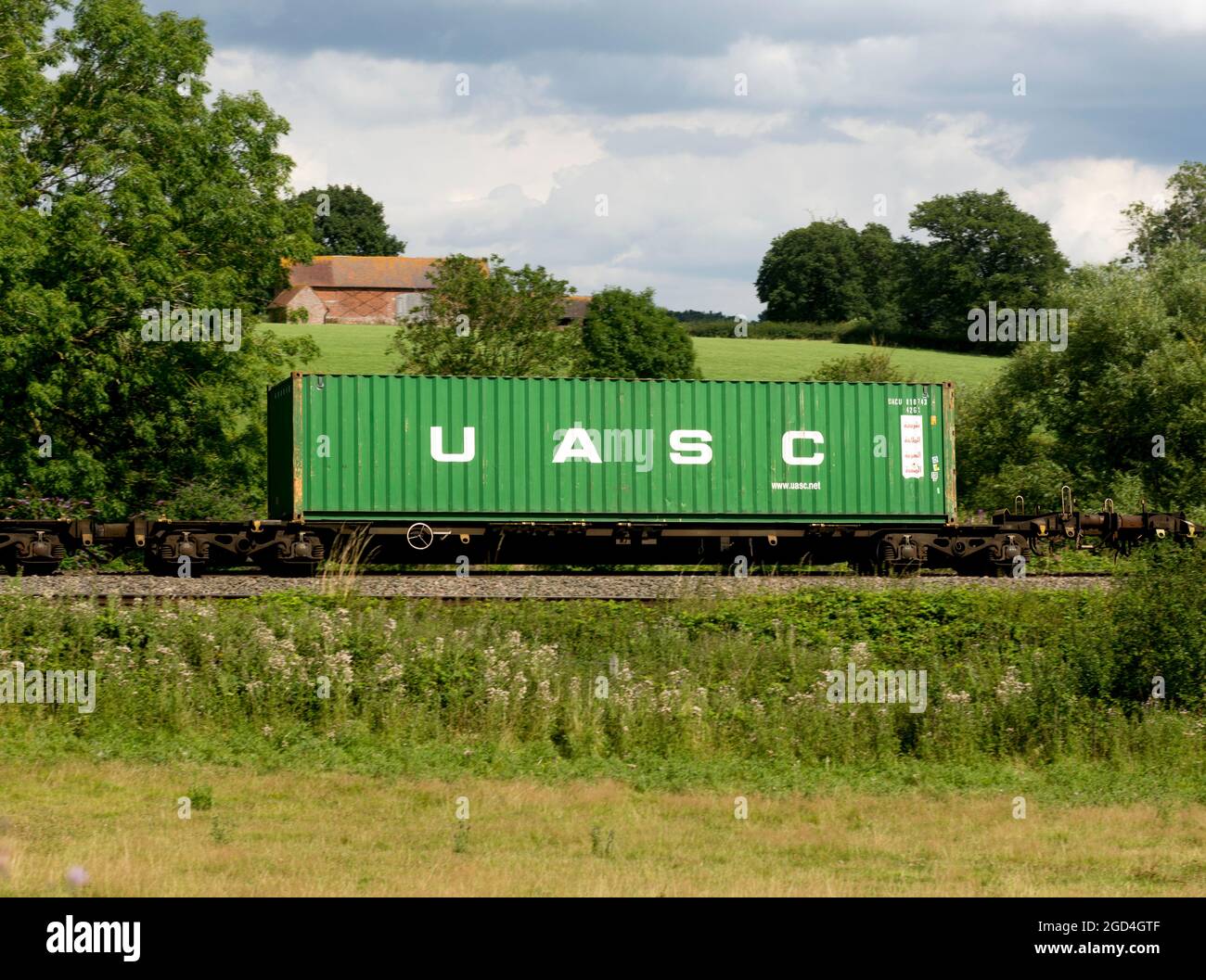 A UASC shipping container on a freightliner train, Warwickshire, UK ...