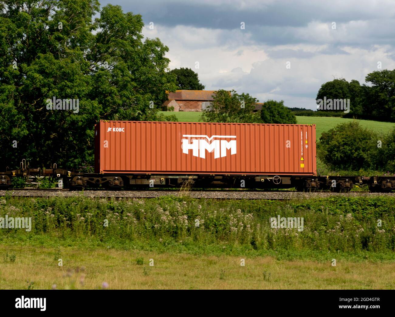 HMM shipping container on a freightliner train, Warwickshire, UK Stock ...