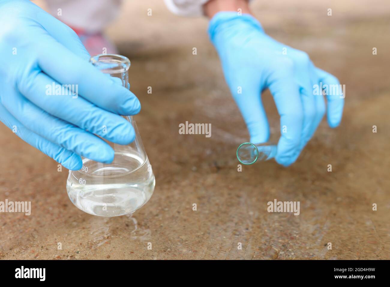 Water samples from river for analysis in flask closeup Stock Photo - Alamy